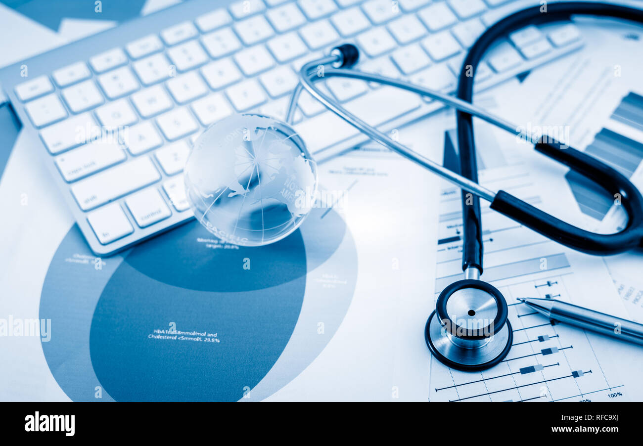 Stethoscope with financial statement on the desk Stock Photo - Alamy