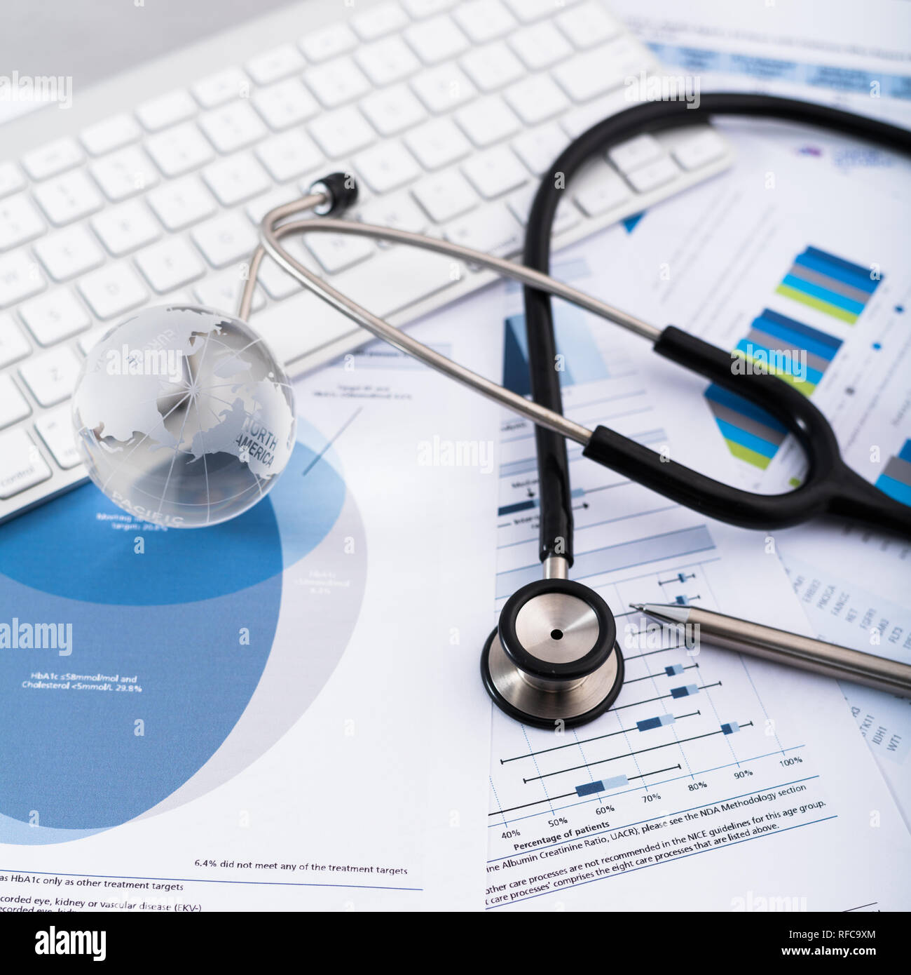 Stethoscope with financial on the desk Stock Photo - Alamy