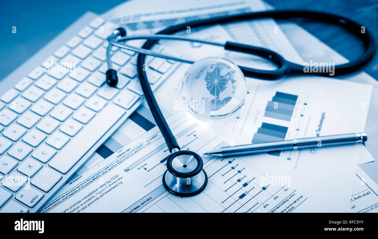 Stethoscope with financial statement on the desk Stock Photo - Alamy