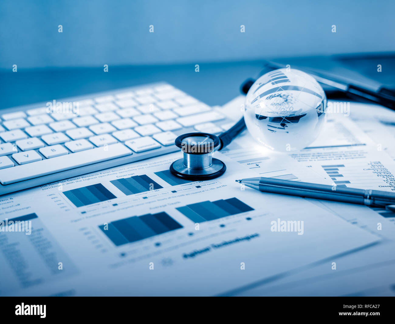 Stethoscope with financial on the desk Stock Photo - Alamy