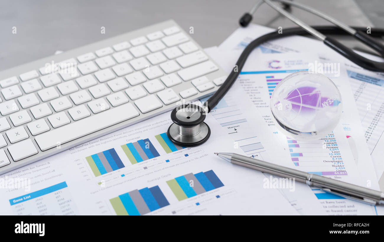 Stethoscope with financial on the desk Stock Photo - Alamy
