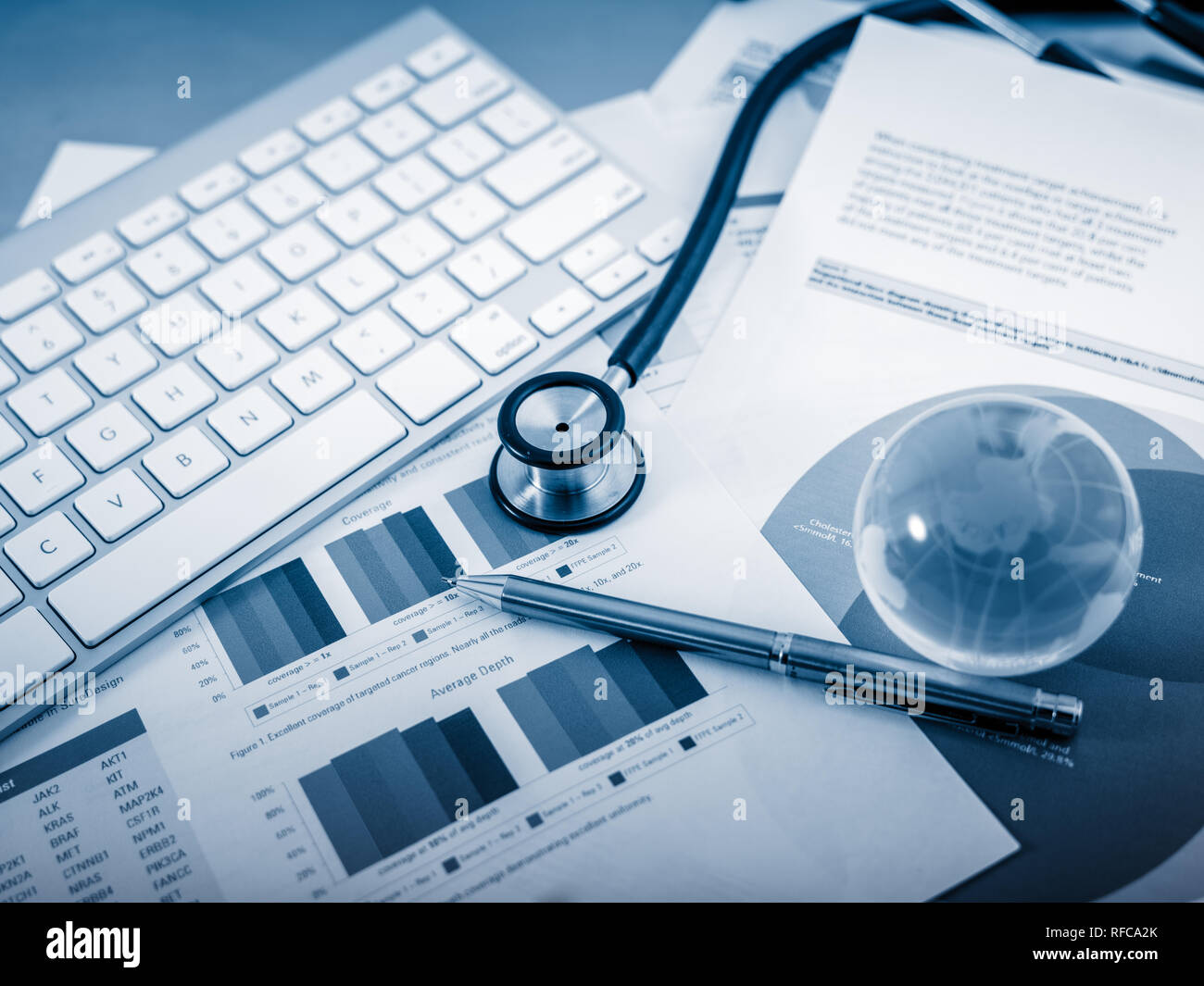 Stethoscope with financial on the desk Stock Photo - Alamy