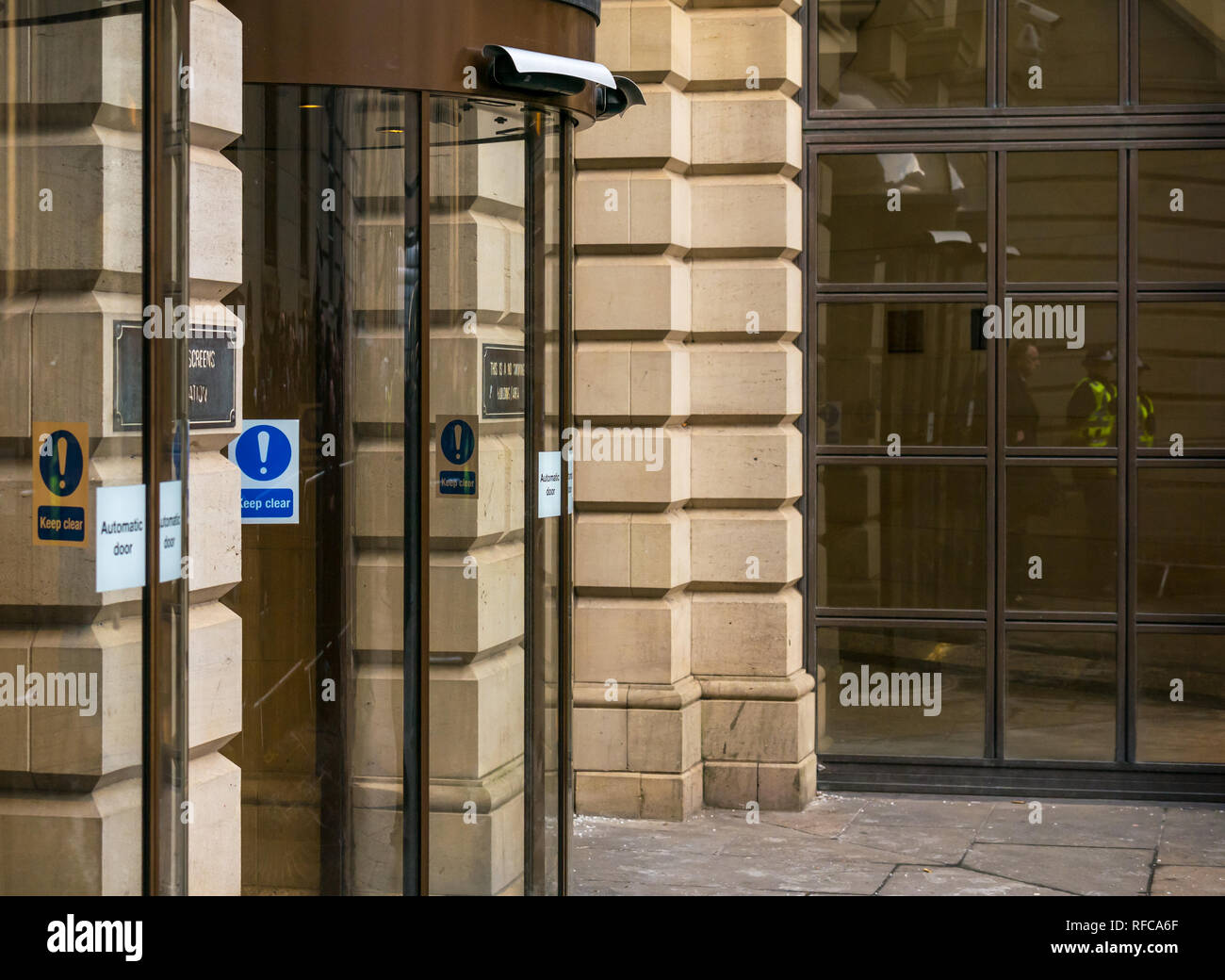 Edinburgh Sheriff Court revolving front doors with reflections on ...