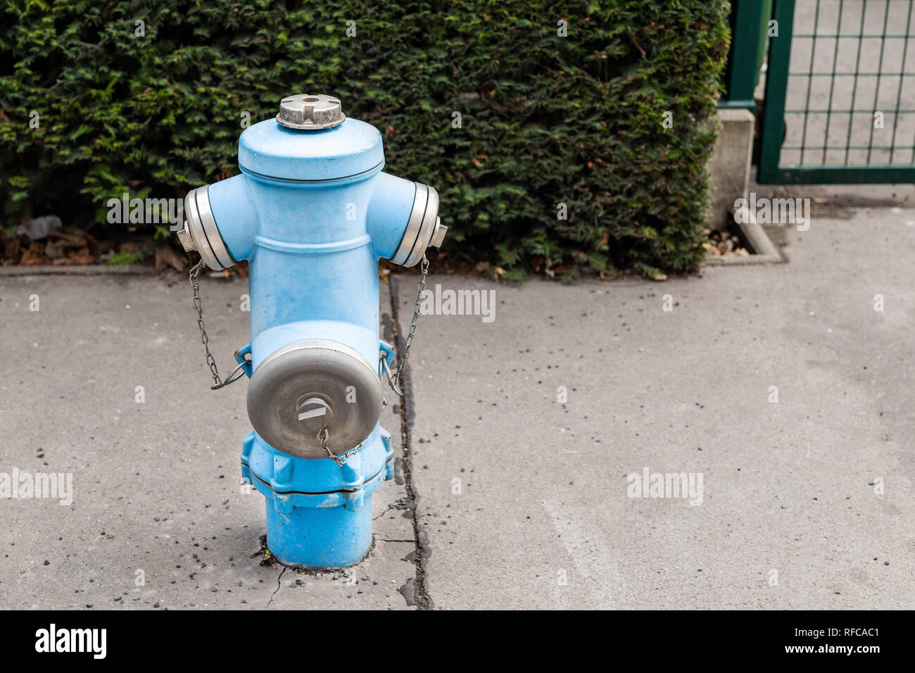 Blue metal vintage fire hydrant on asphalt road at city street Stock ...