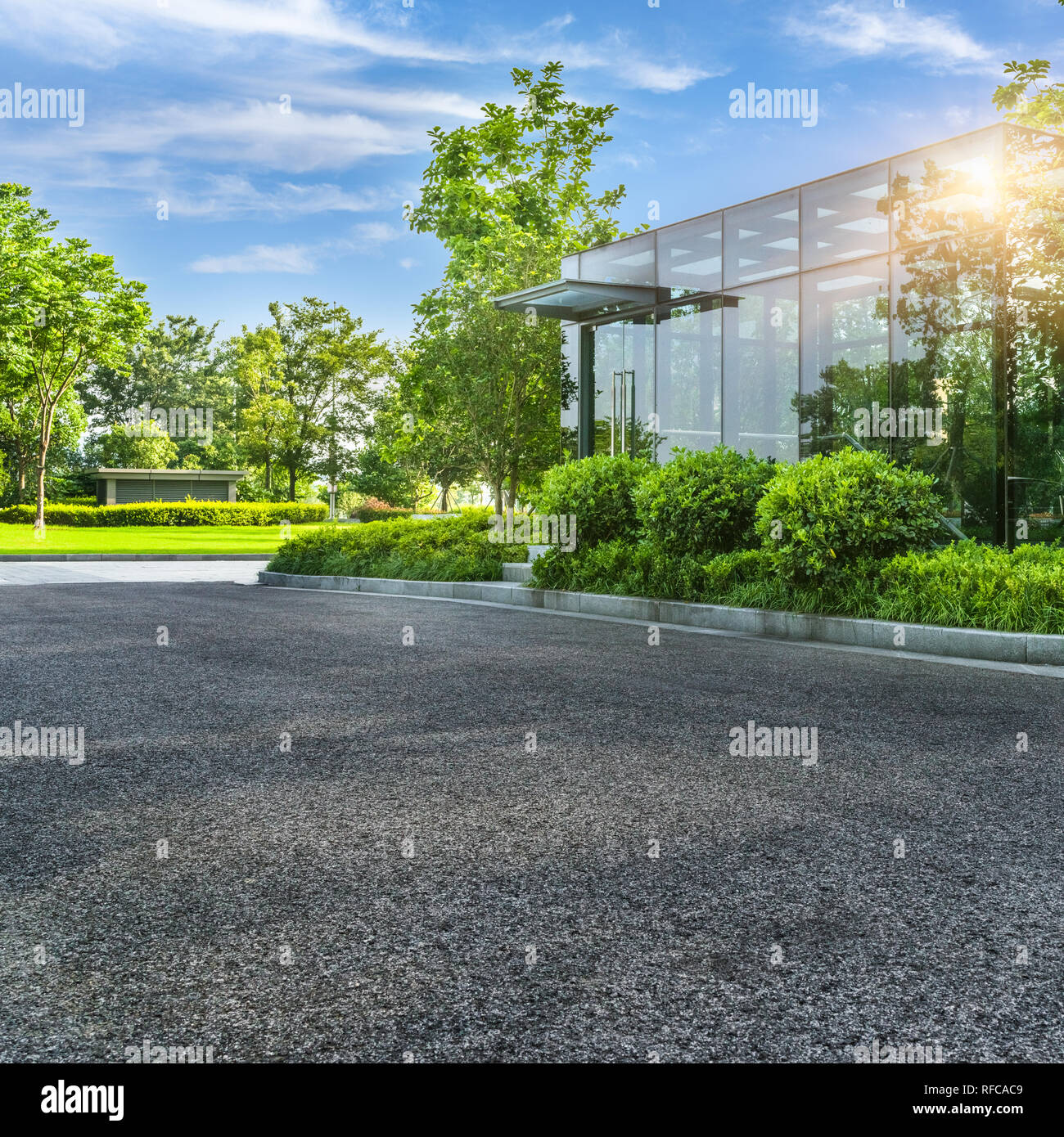 empty asphalt road by modern office building Stock Photo - Alamy