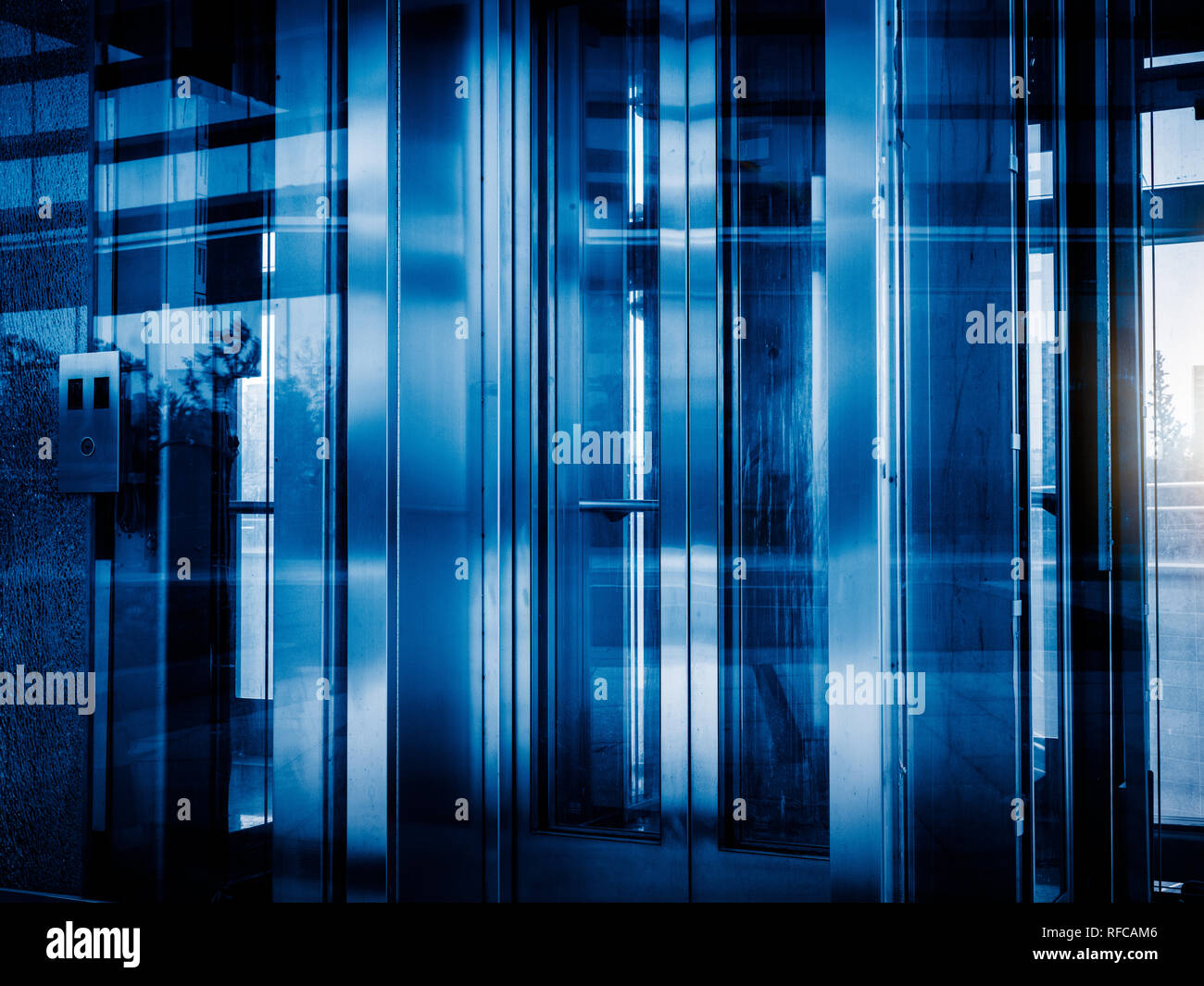 modern glass office building,blue toned Stock Photo - Alamy