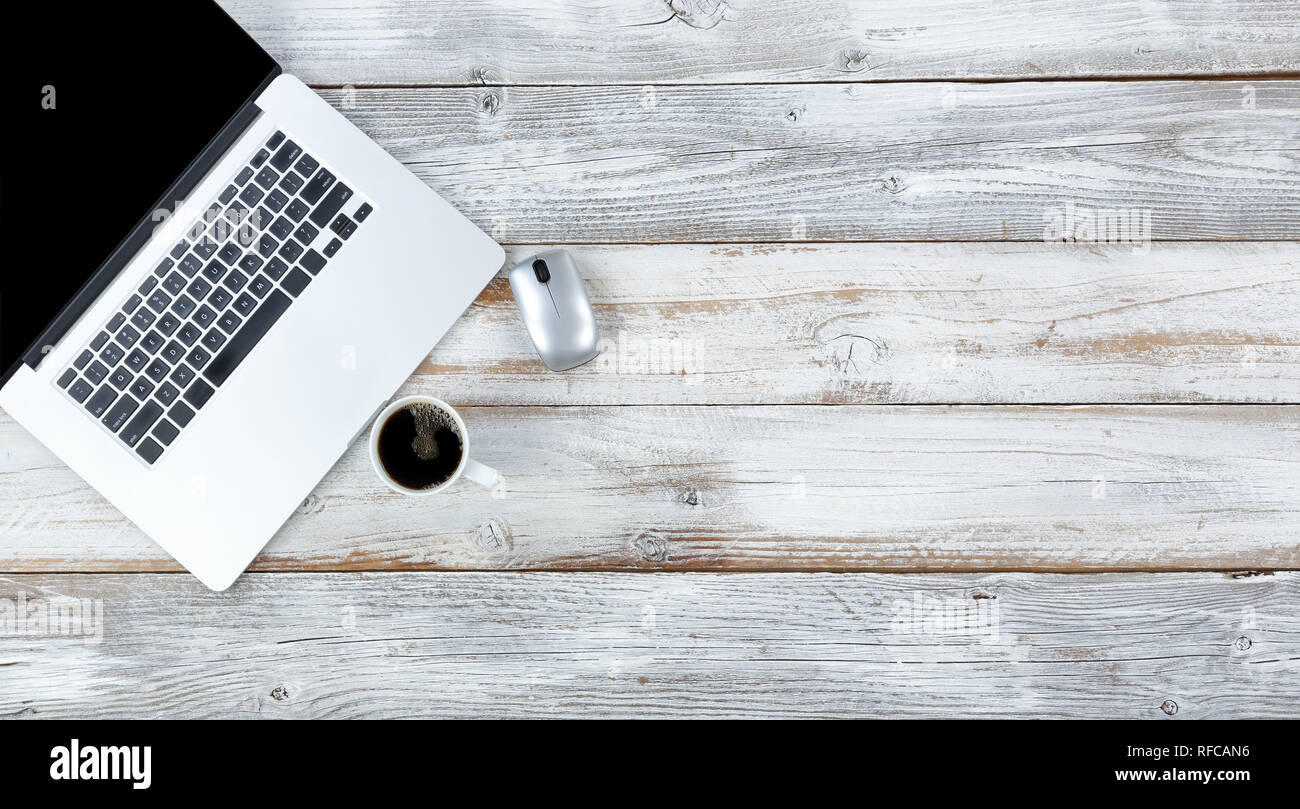 Overhead view of desktop with computer mouse and coffee plus plenty of ...