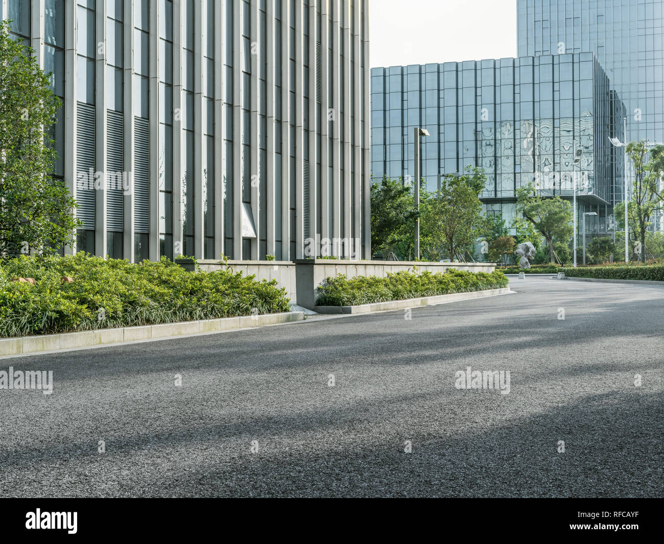 empty asphalt road by modern office building Stock Photo - Alamy