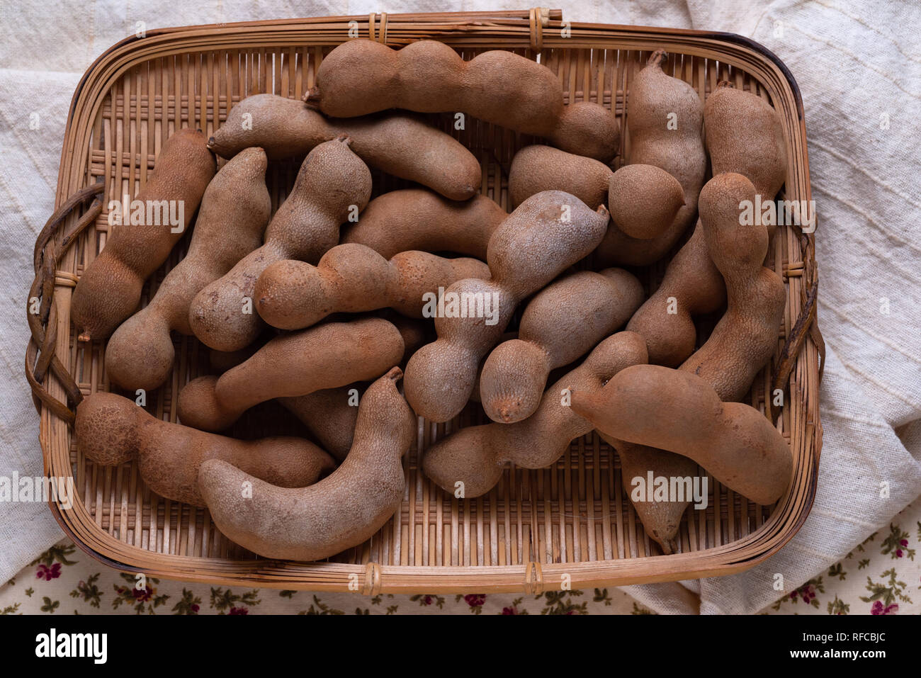 Tamarind in wicker basket Stock Photo - Alamy