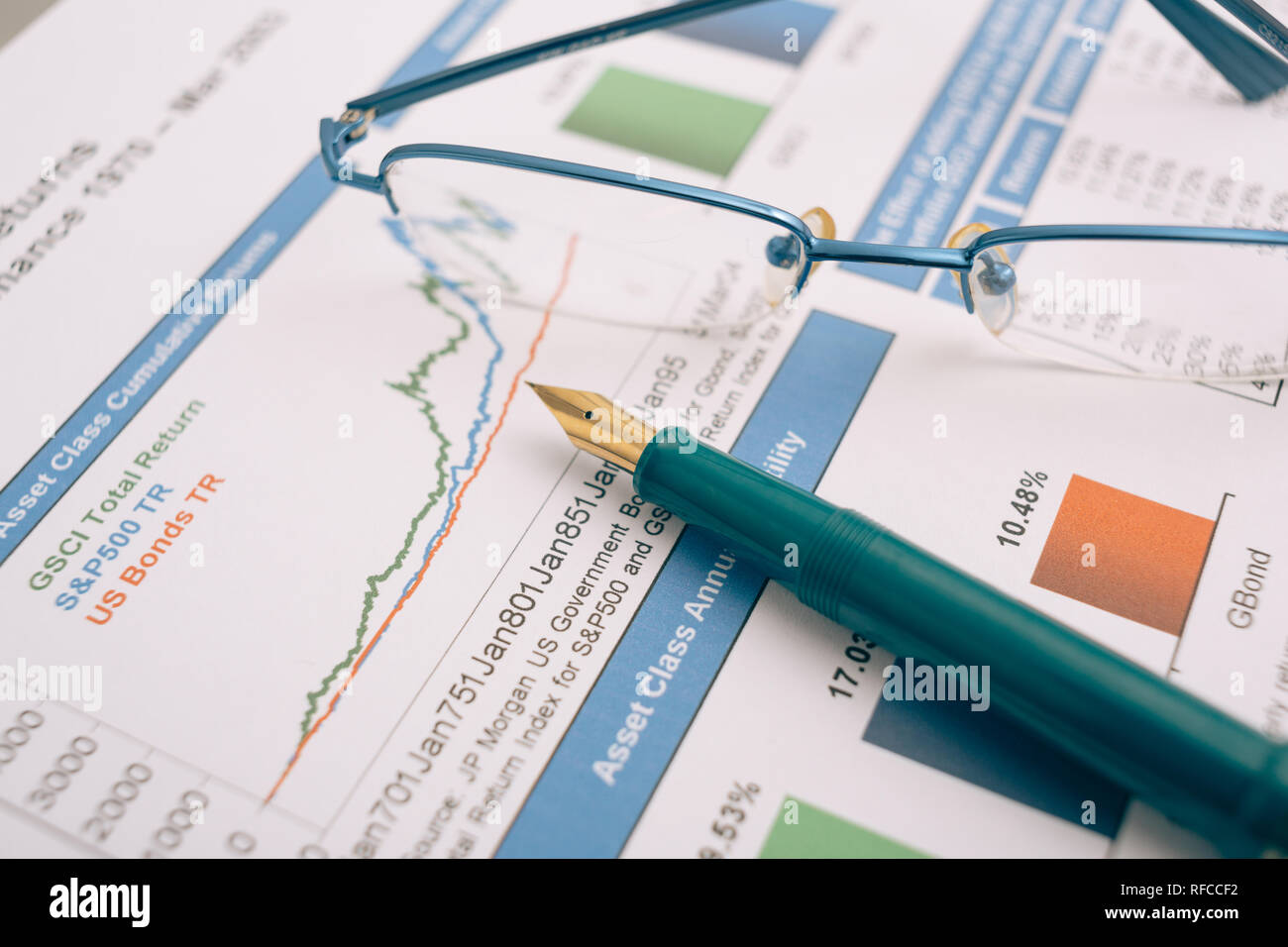 Business presentation with finance chart on the desk Stock Photo - Alamy