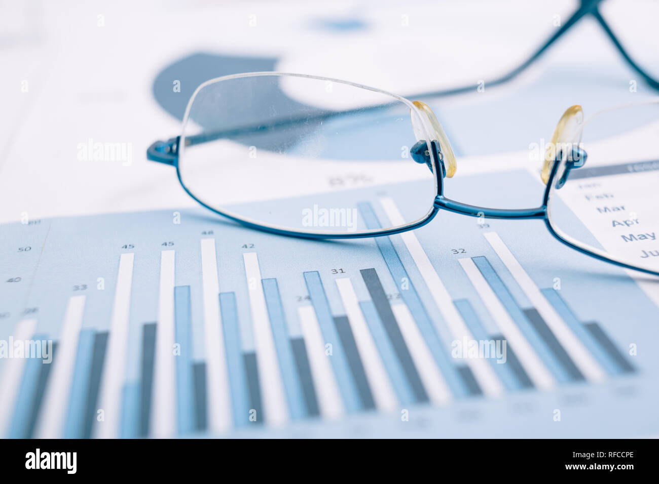 Business presentation with finance chart on the desk Stock Photo - Alamy
