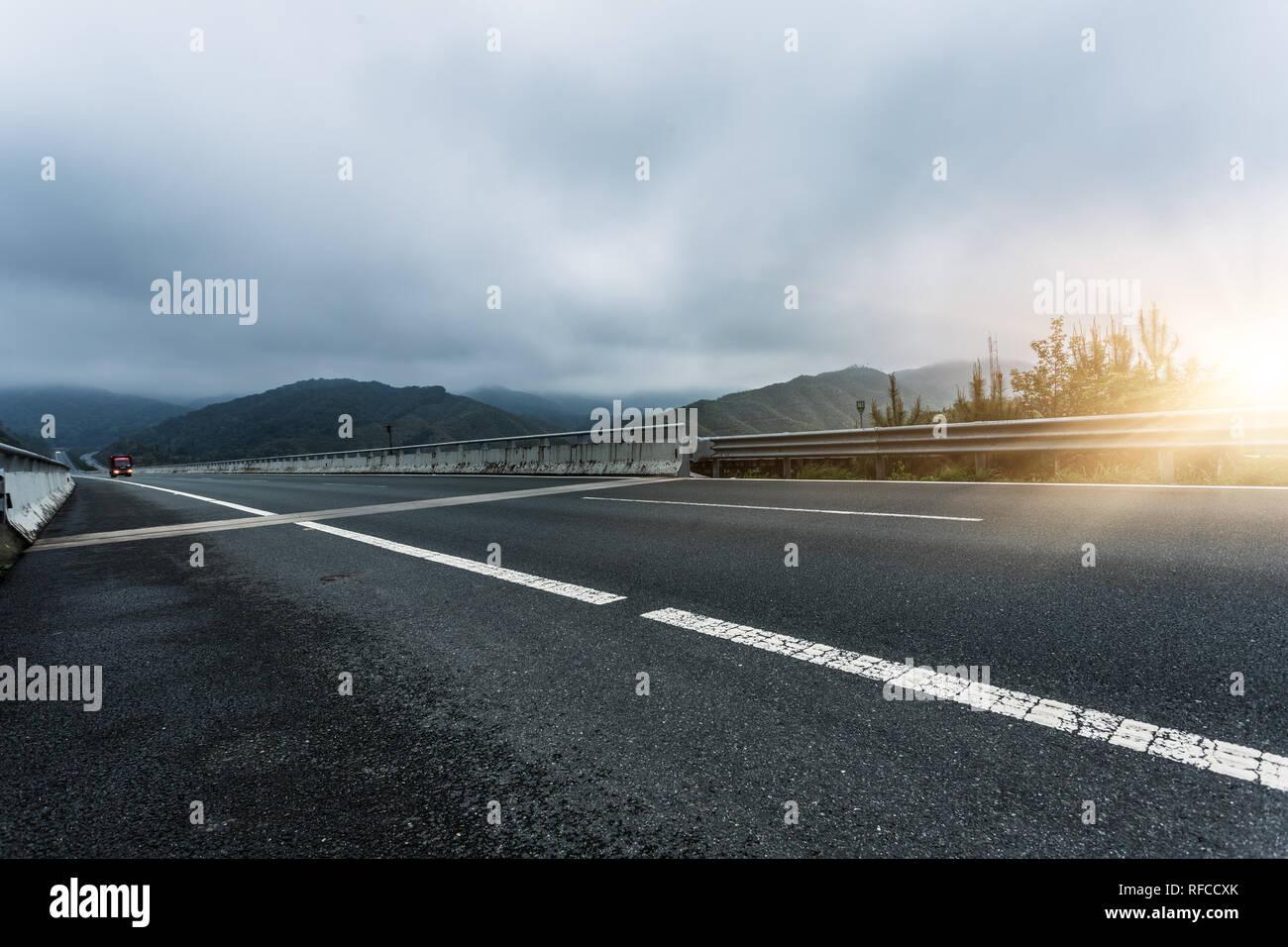 empty asphaly highway amidst mountains,china Stock Photo - Alamy