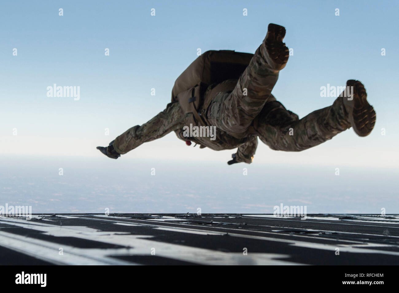 A paratrooper jumps out of a 97th Air Mobility Wing C-17 Globemaster ...