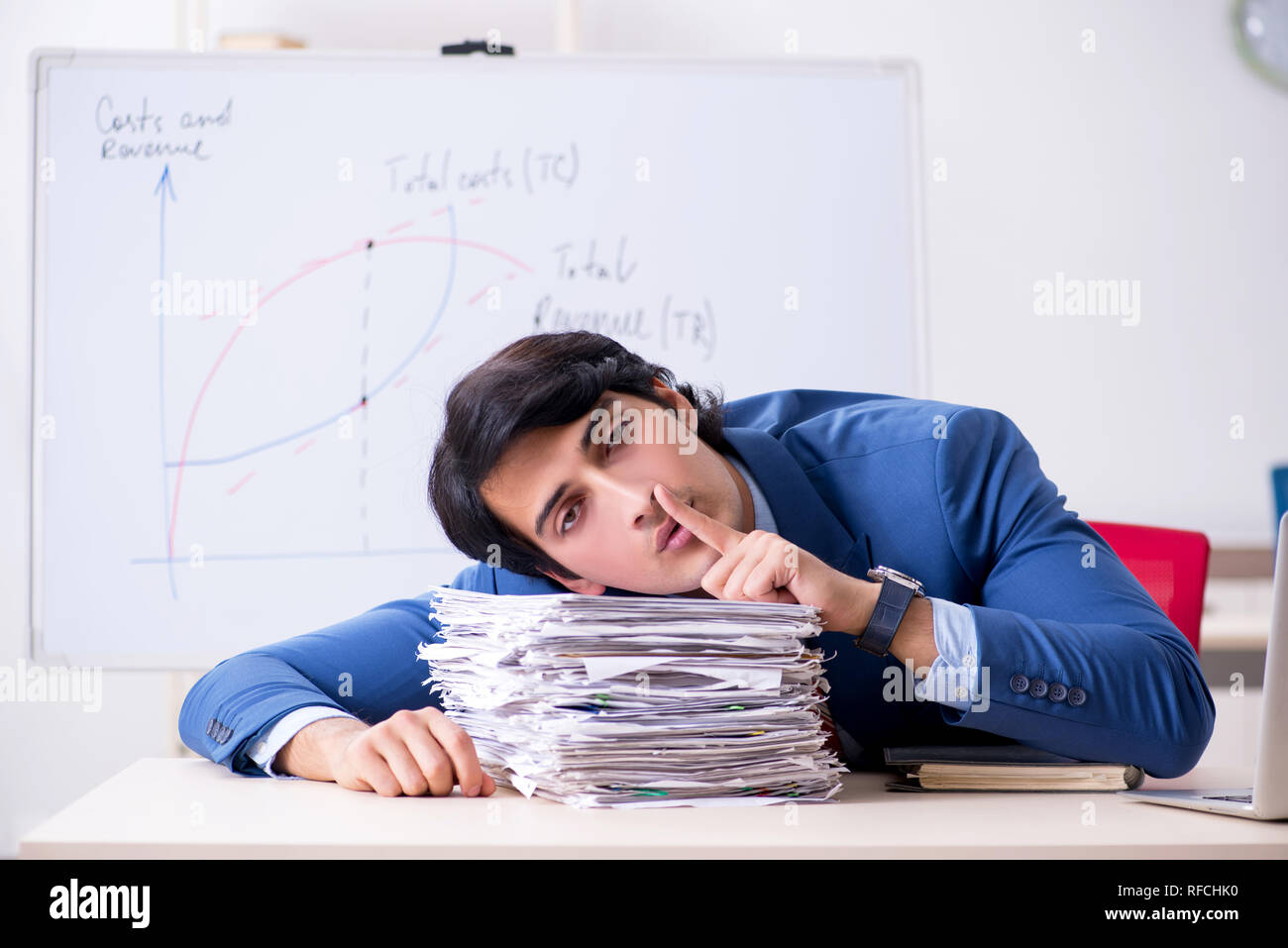 Busy businessman explaining business charts Stock Photo - Alamy