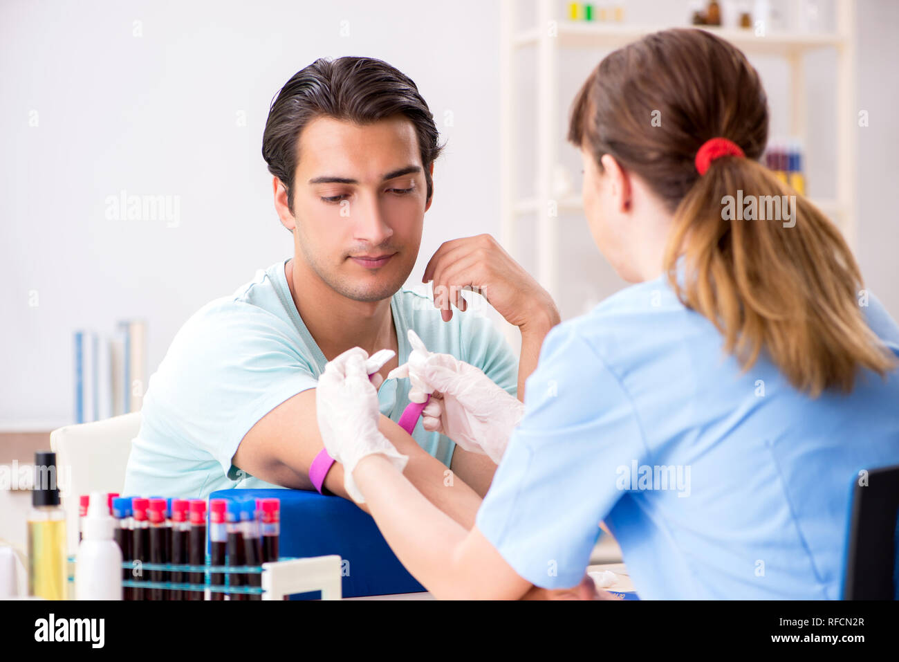 Young patient during blood test sampling procedure Stock Photo - Alamy