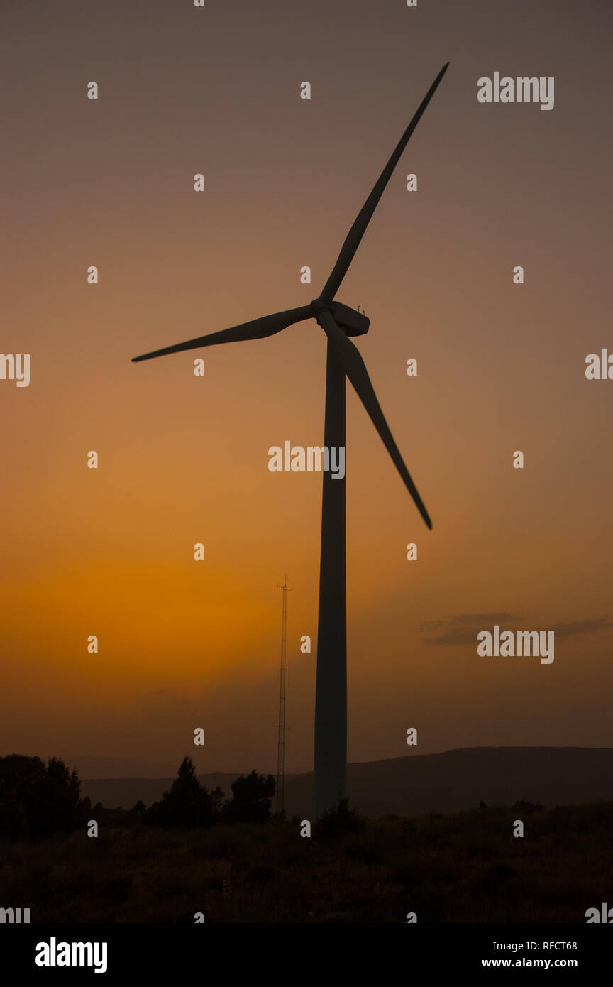 Orange sky and one windmill at countryside Stock Photo - Alamy