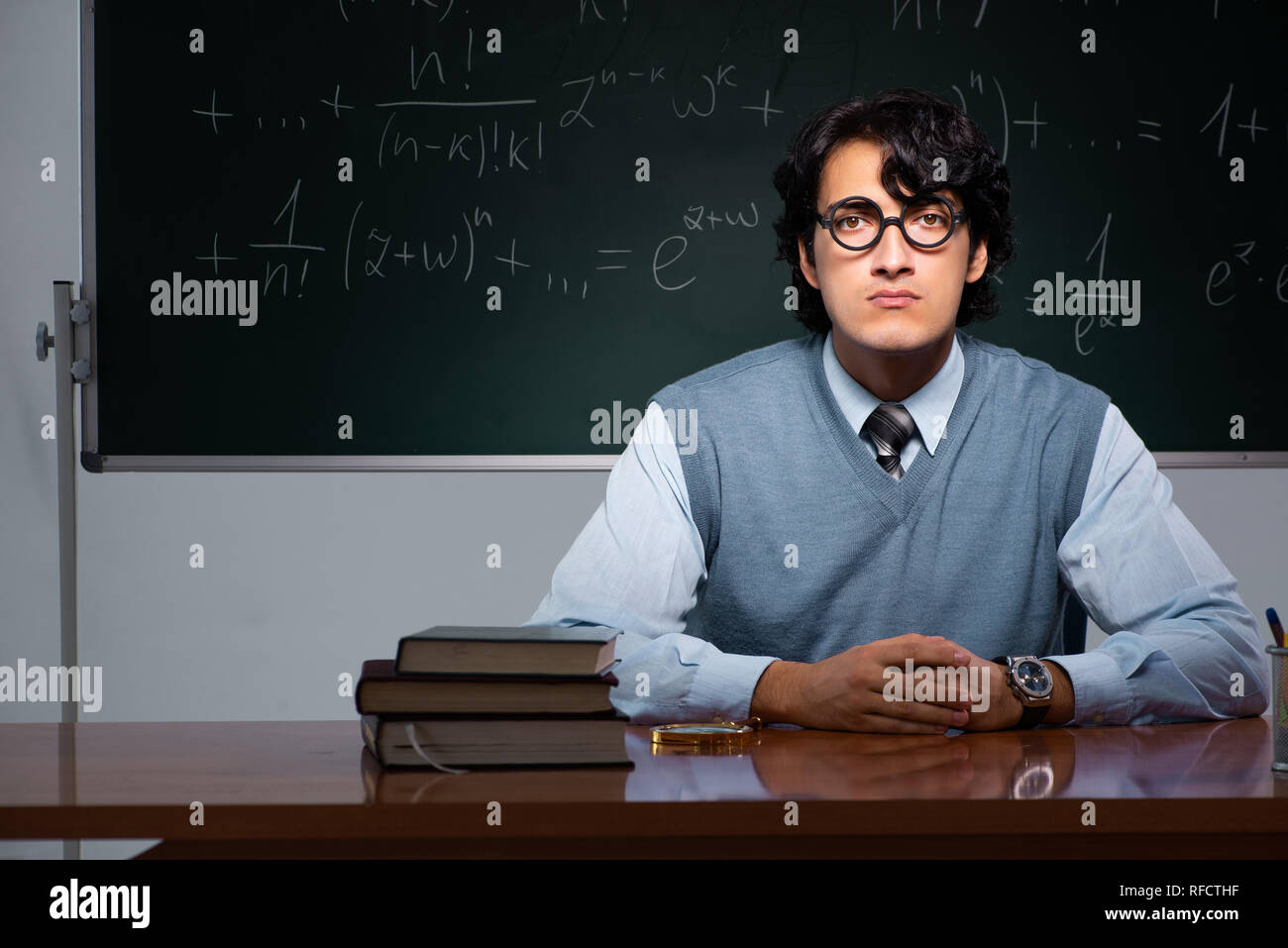 Man in front of blackboard math hi-res stock photography and images - Alamy