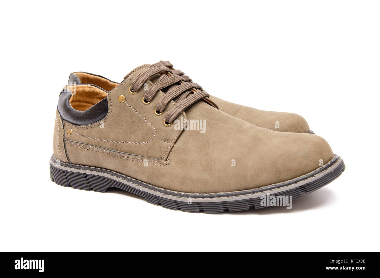 Brown suade shoes isolated on white background Stock Photo - Alamy
