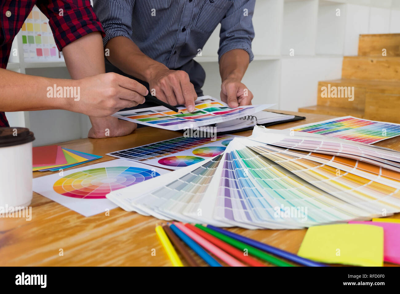 Graphic designers choose colors from the color bands samples for design ...