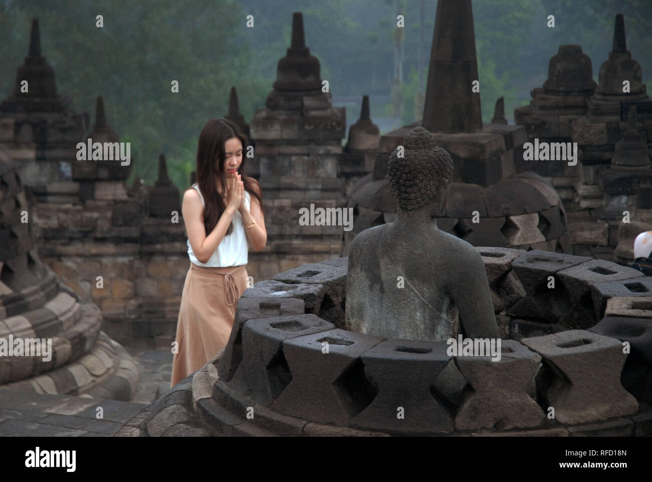 Chinese woman praying at Borobudur Buddhist Temple, Muntilan, Central Java, Indonesia Stock ...