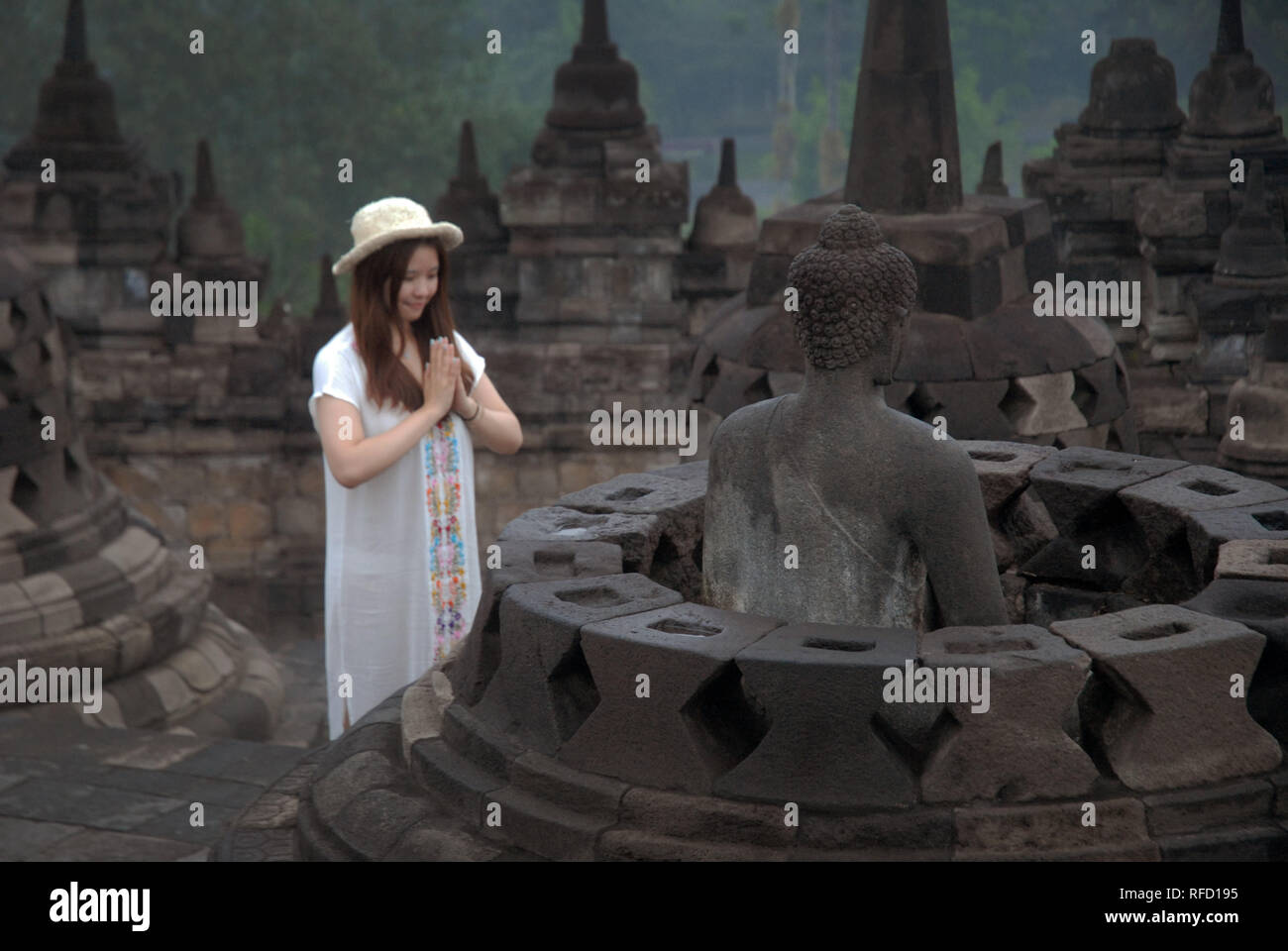 Chinese woman praying at Borobudur Buddhist Temple, Muntilan, Central Java, Indonesia Stock ...