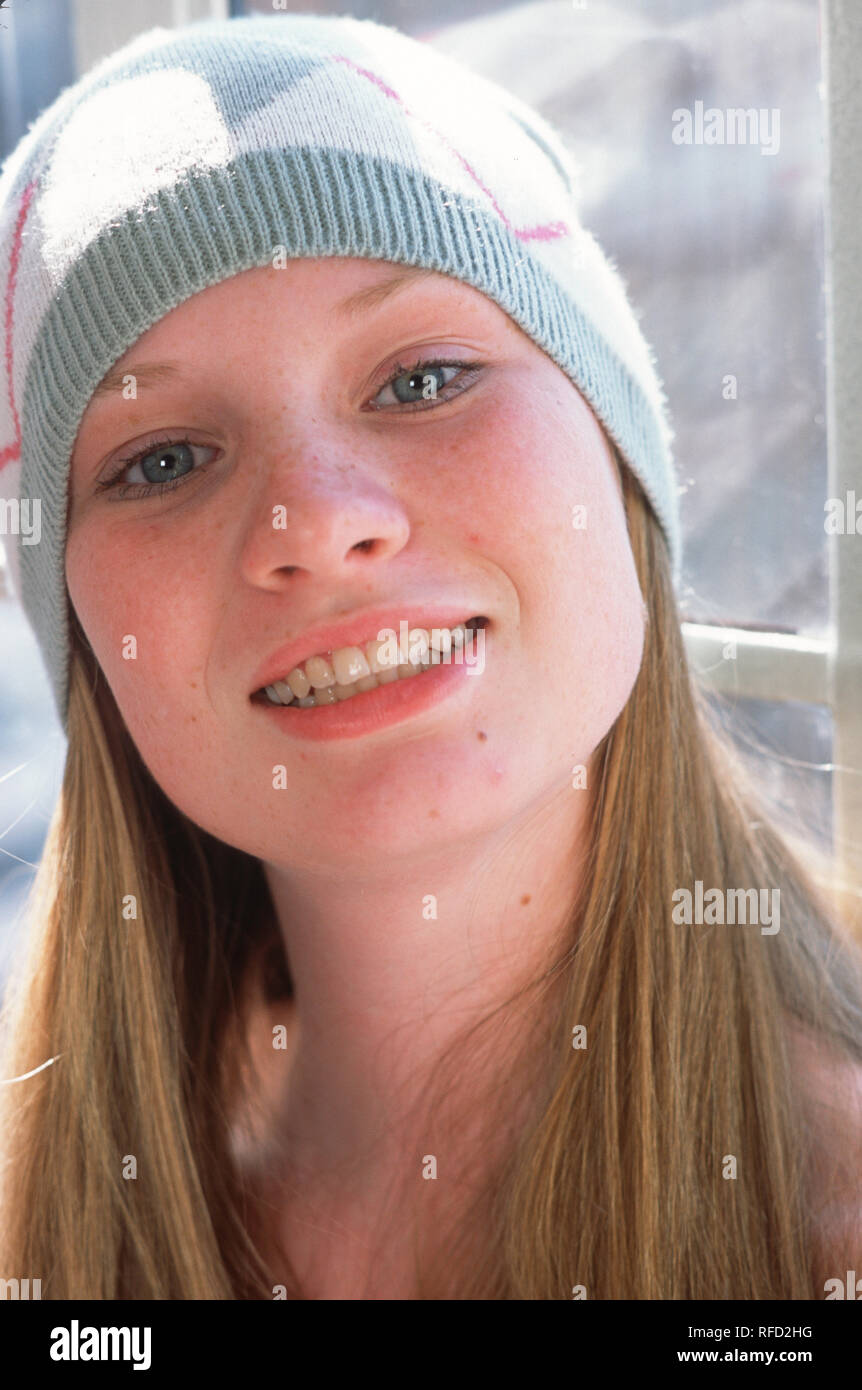 Cute Teenage Girl with a Knit Cap Looks at Camera, USA Stock Photo - Alamy