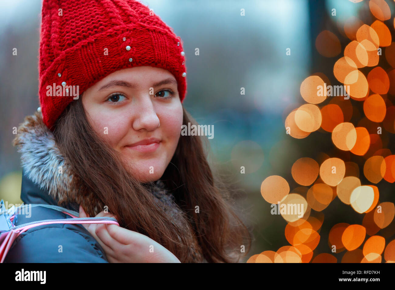 beautiful red head young teenager in the city outdoors abstract blur ...