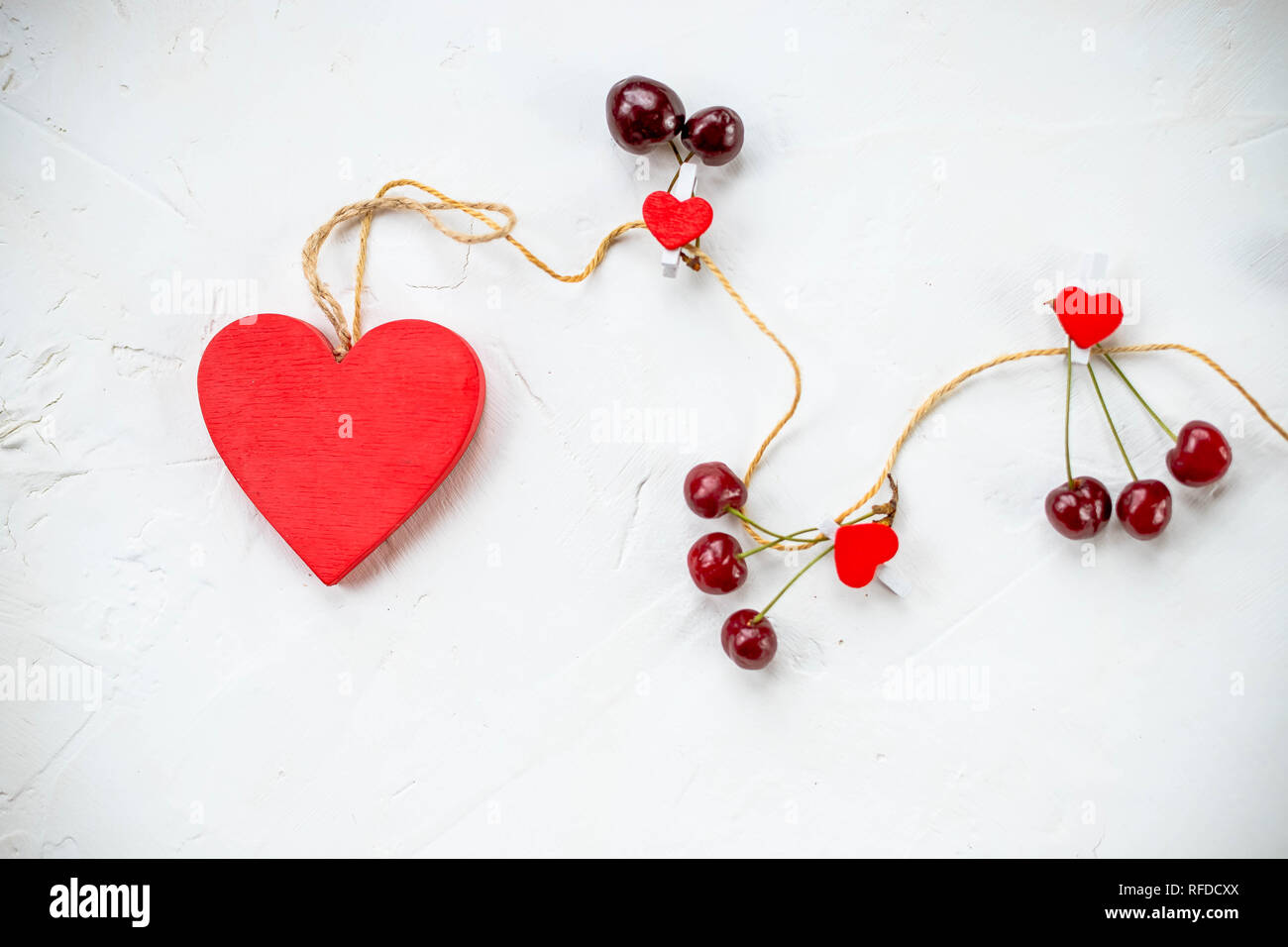 Fresh ripe cherry and red heart isolated on white background.Fit and ...