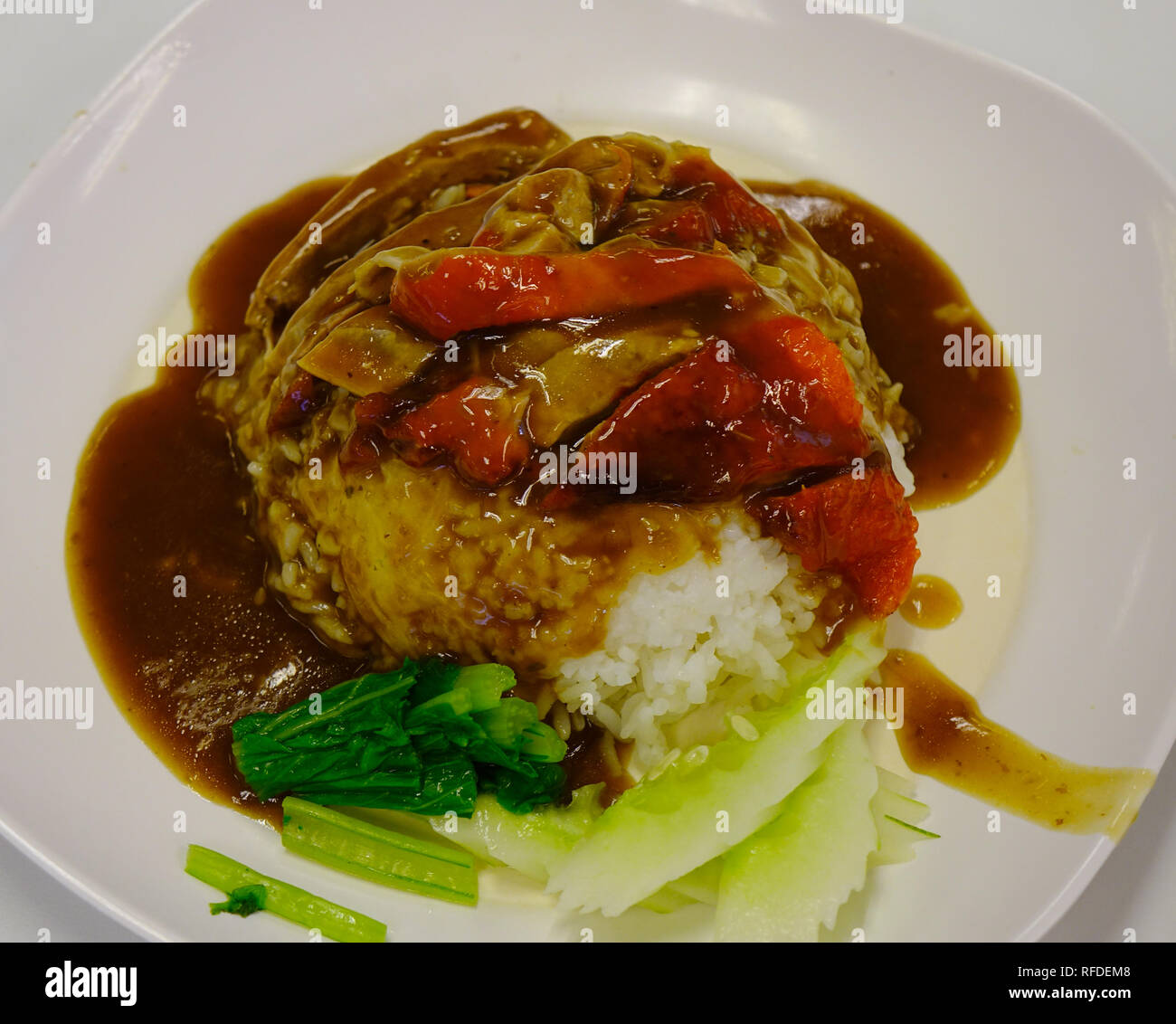 Red roasted duck on steamed rice - Chinese cuisine Stock Photo - Alamy