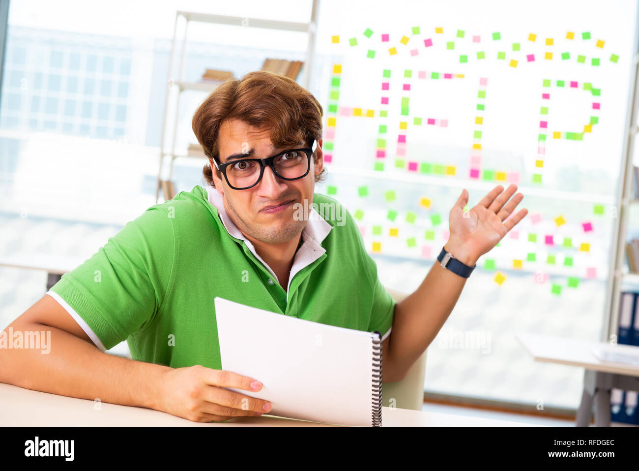 Student struggling at the exam in classroom Stock Photo - Alamy
