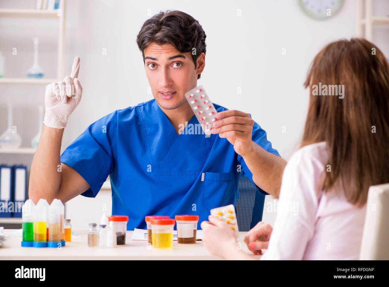 Patient visiting doctor for urine test Stock Photo - Alamy