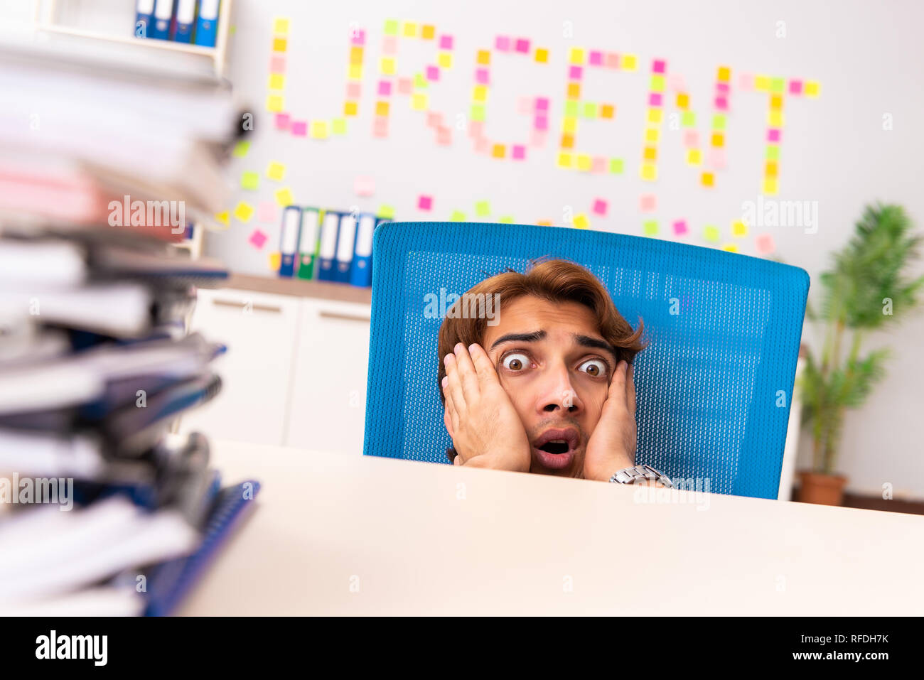 Hiding from boss hi-res stock photography and images - Alamy