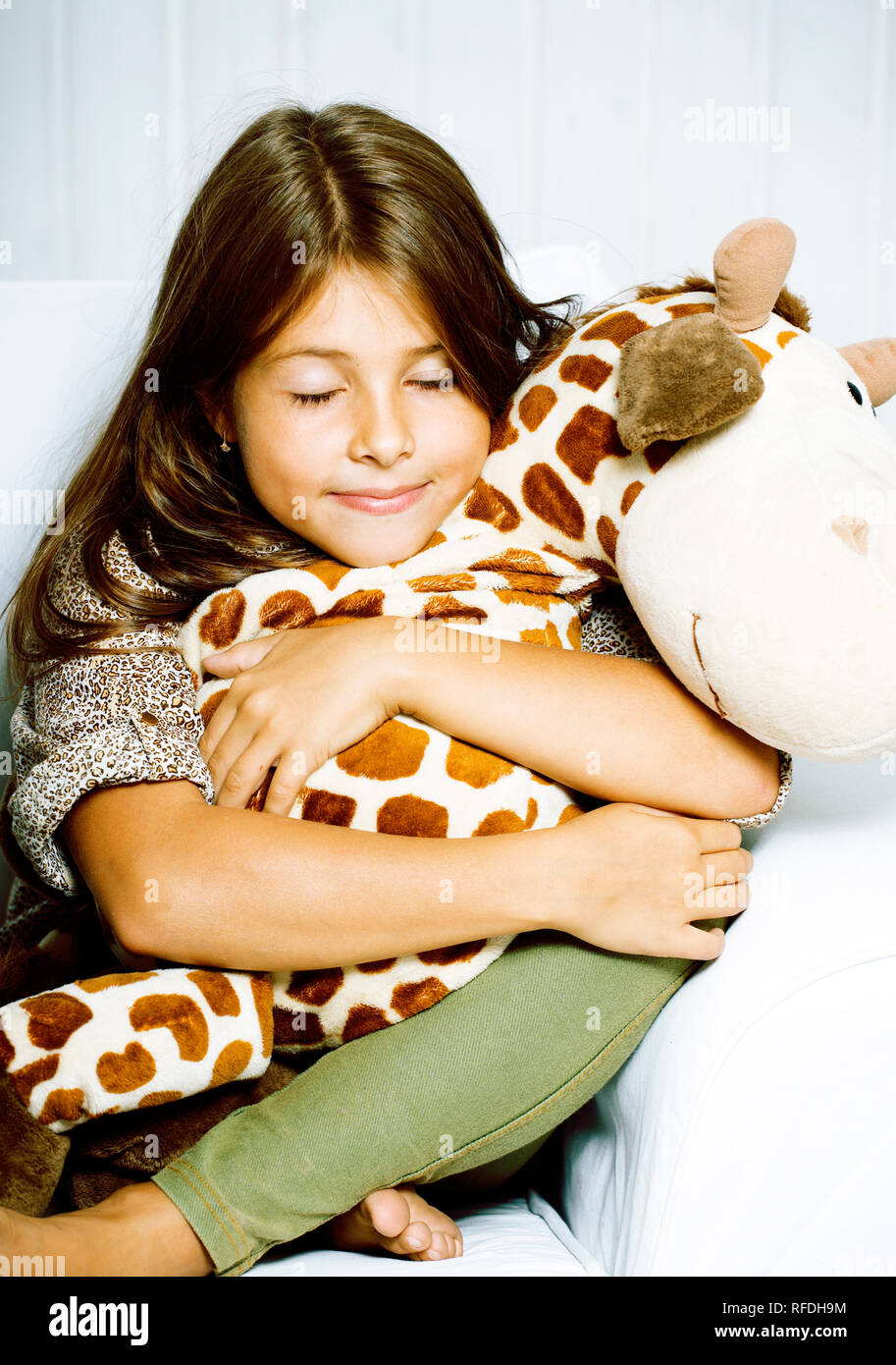 little cute brunette girl at home interior happy smiling close up ...