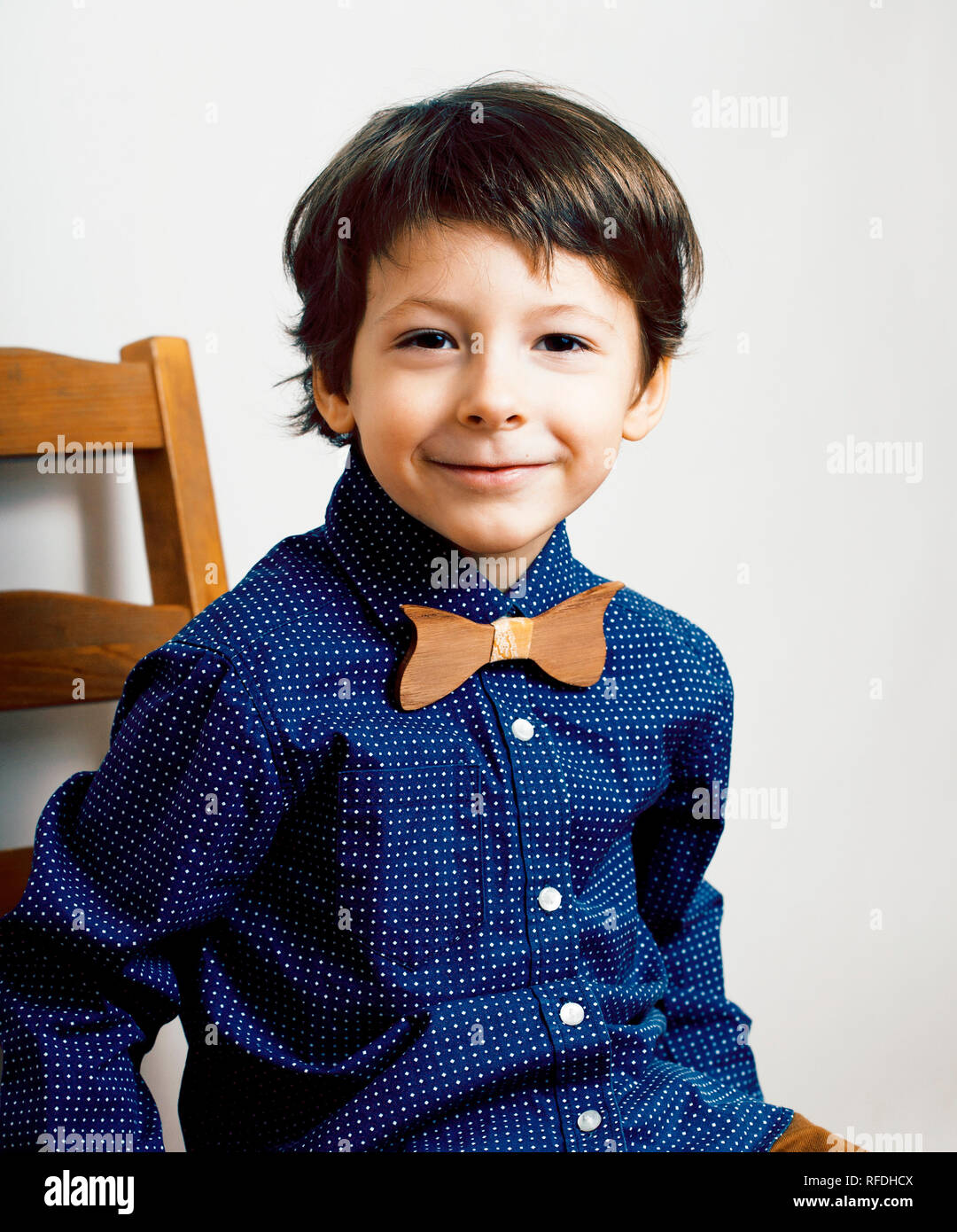 little cute boy on white background gesture tumbs up smiling closeup ...