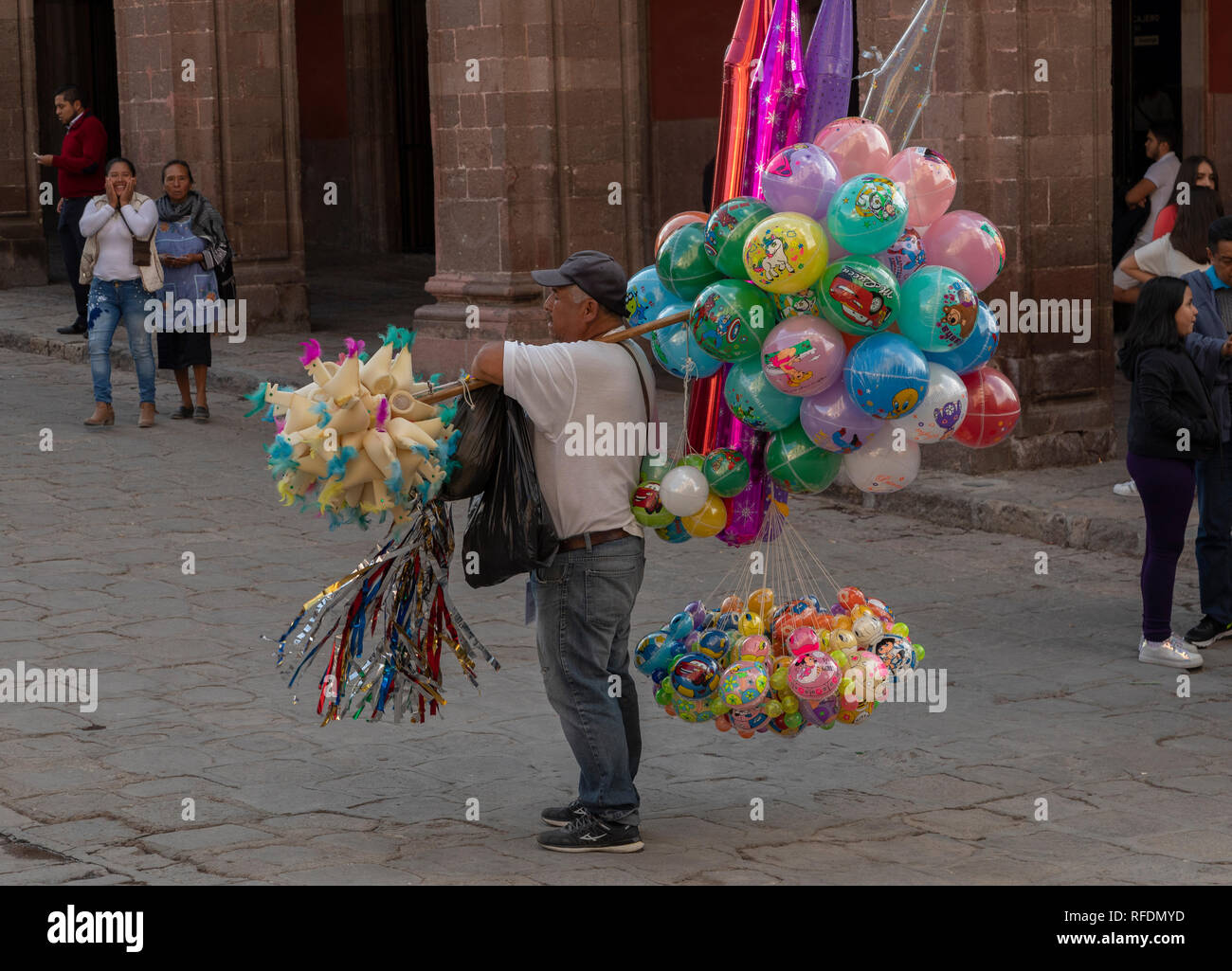 Balloon seller at new year, in the square, San Miguel de Allende ...