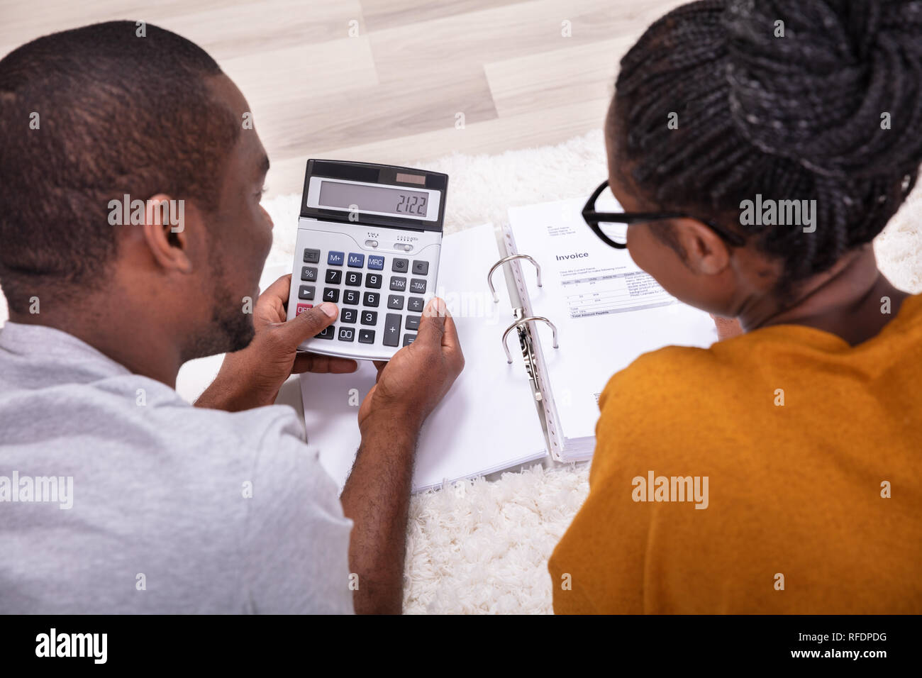 African man counting calculator hi-res stock photography and images - Alamy