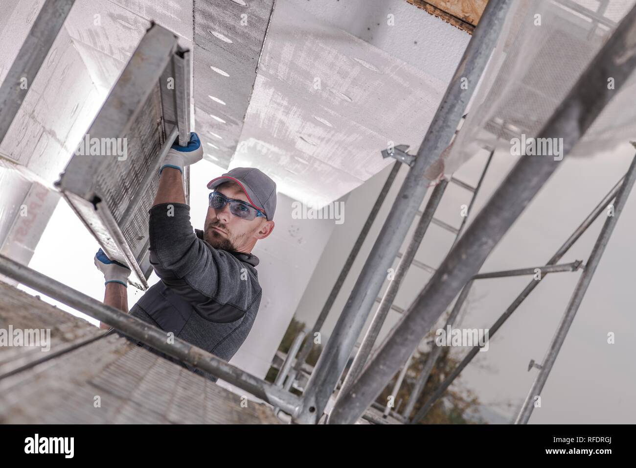 Scaffolding Installation by Caucasian Construction Worker in His 30s ...