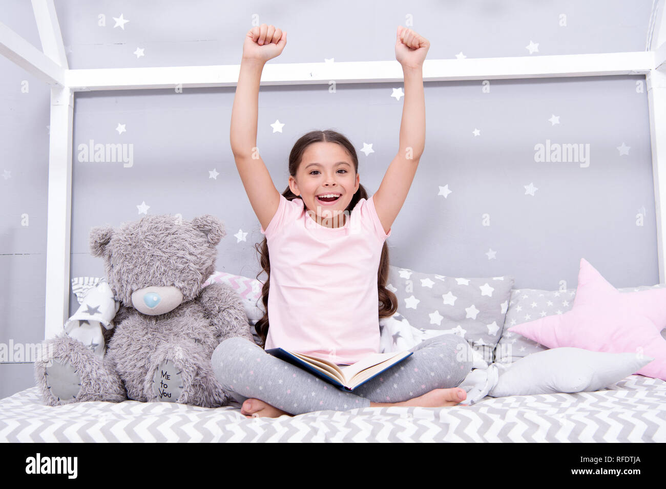 Finished reading book. Girl child sit bed with teddy bear finished ...