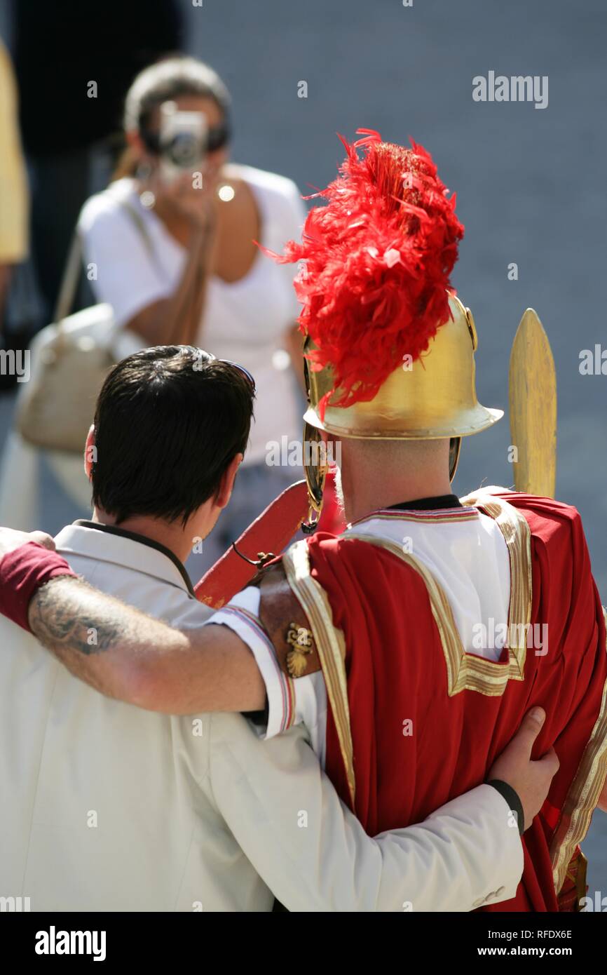 Tourist takes a photo with a roman soldier actor, Rome, Italy Stock ...