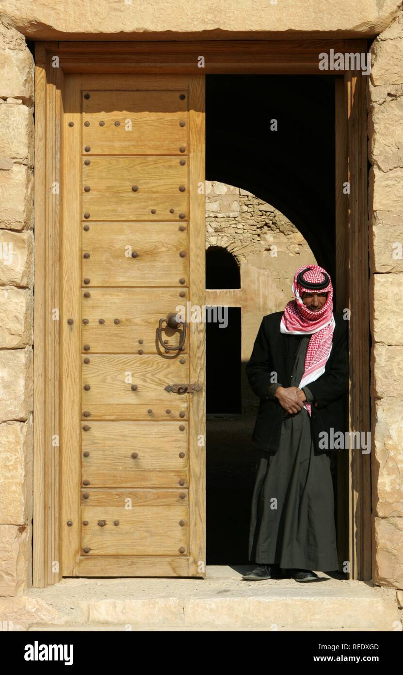 JOR, Jordan : Guard man of the desert Castle Qasr al-Kharana ...