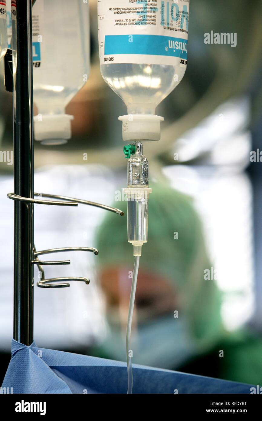 Bottle with infusion liquid for a patient during operation Stock Photo ...
