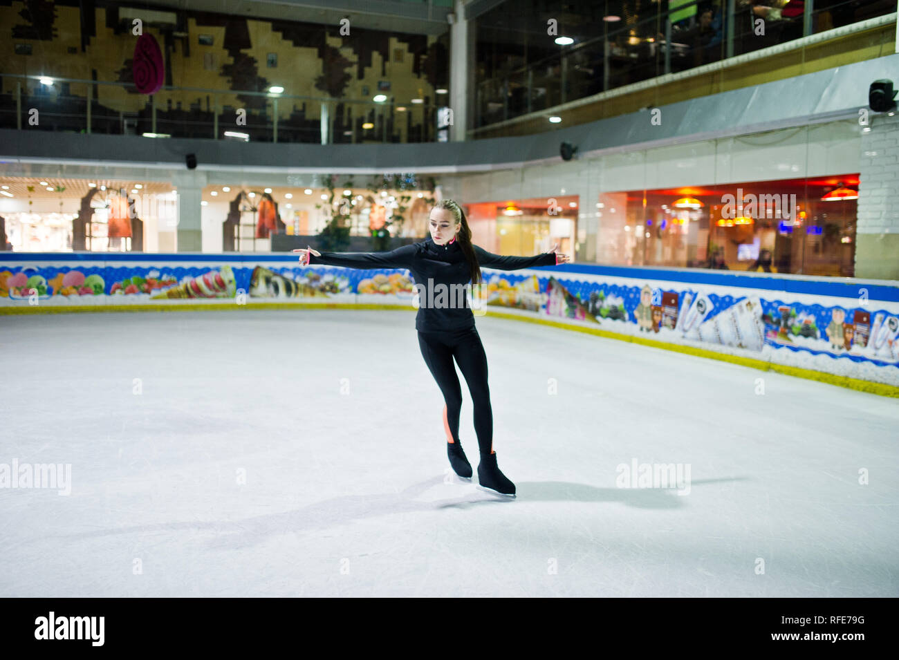 Figure skater woman at ice skating rink Stock Photo - Alamy