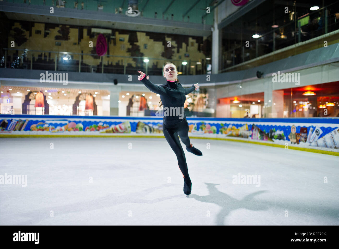 Figure skater woman at ice skating rink Stock Photo - Alamy