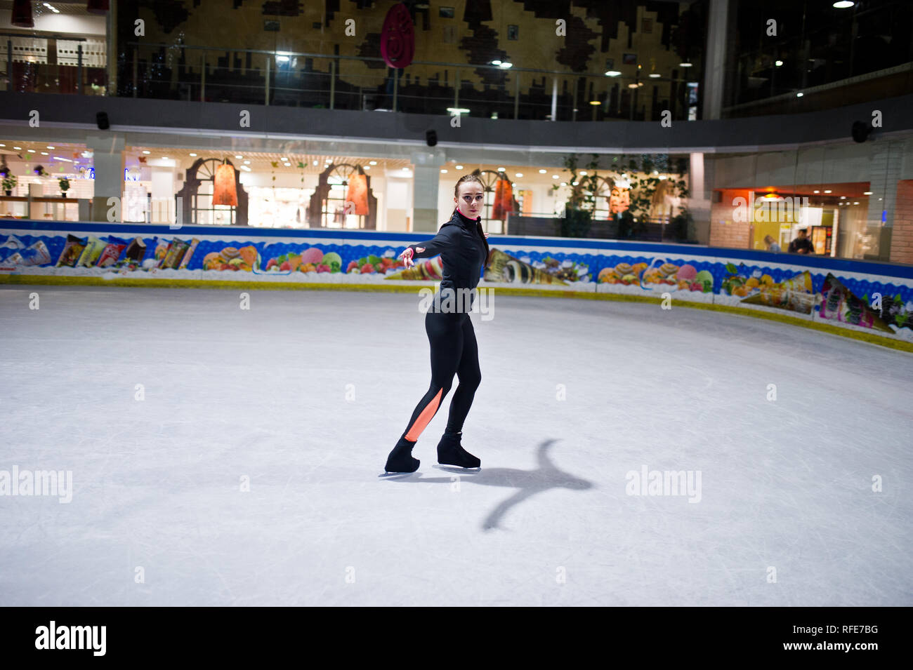 Figure skater woman at ice skating rink Stock Photo - Alamy
