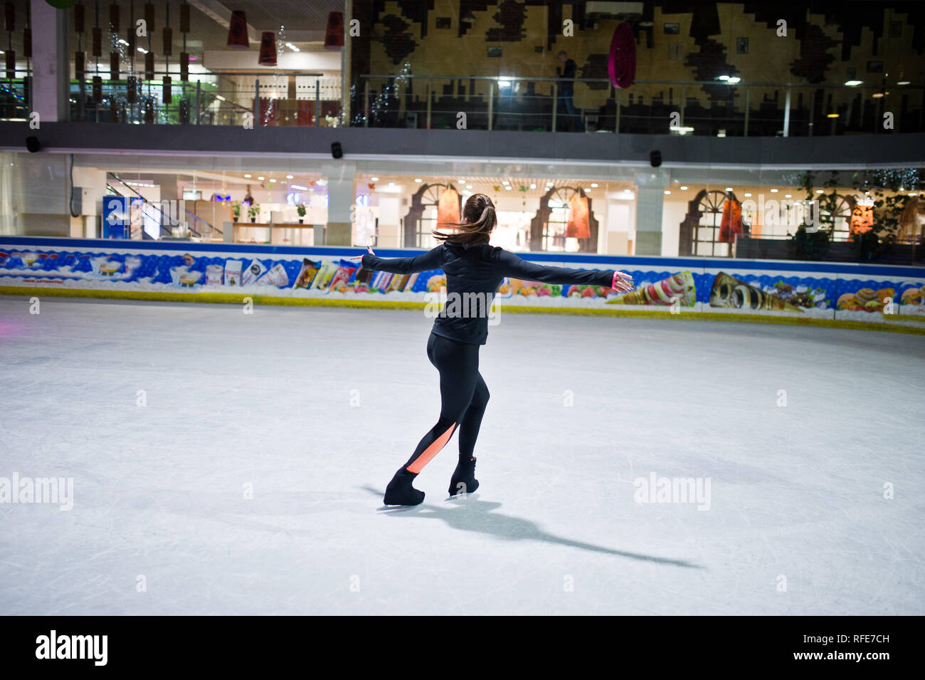 Figure skater woman at ice skating rink Stock Photo - Alamy