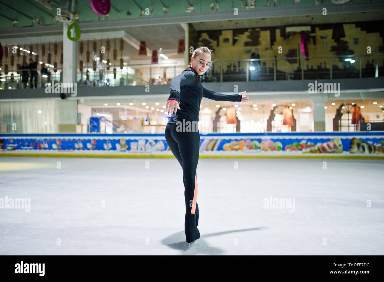 Figure skater woman at ice skating rink Stock Photo - Alamy
