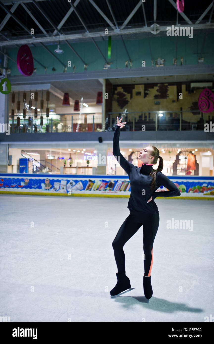 Figure skater woman at ice skating rink Stock Photo - Alamy