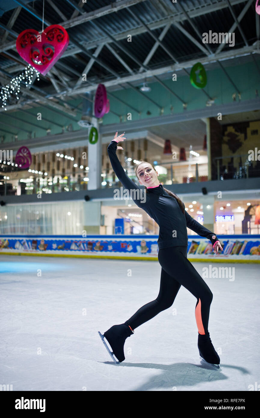 Figure skater woman at ice skating rink Stock Photo - Alamy