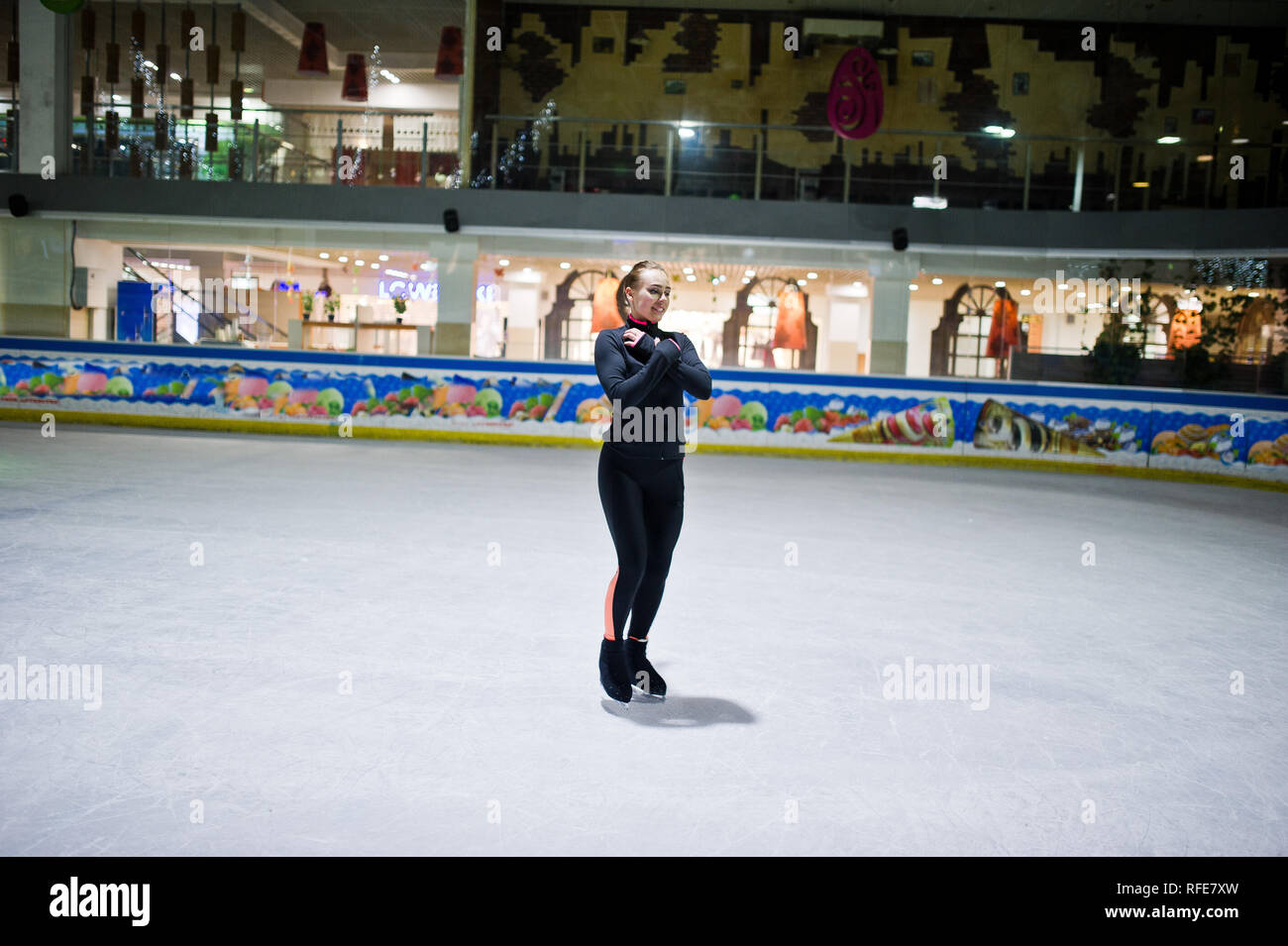 Figure skater woman at ice skating rink Stock Photo - Alamy