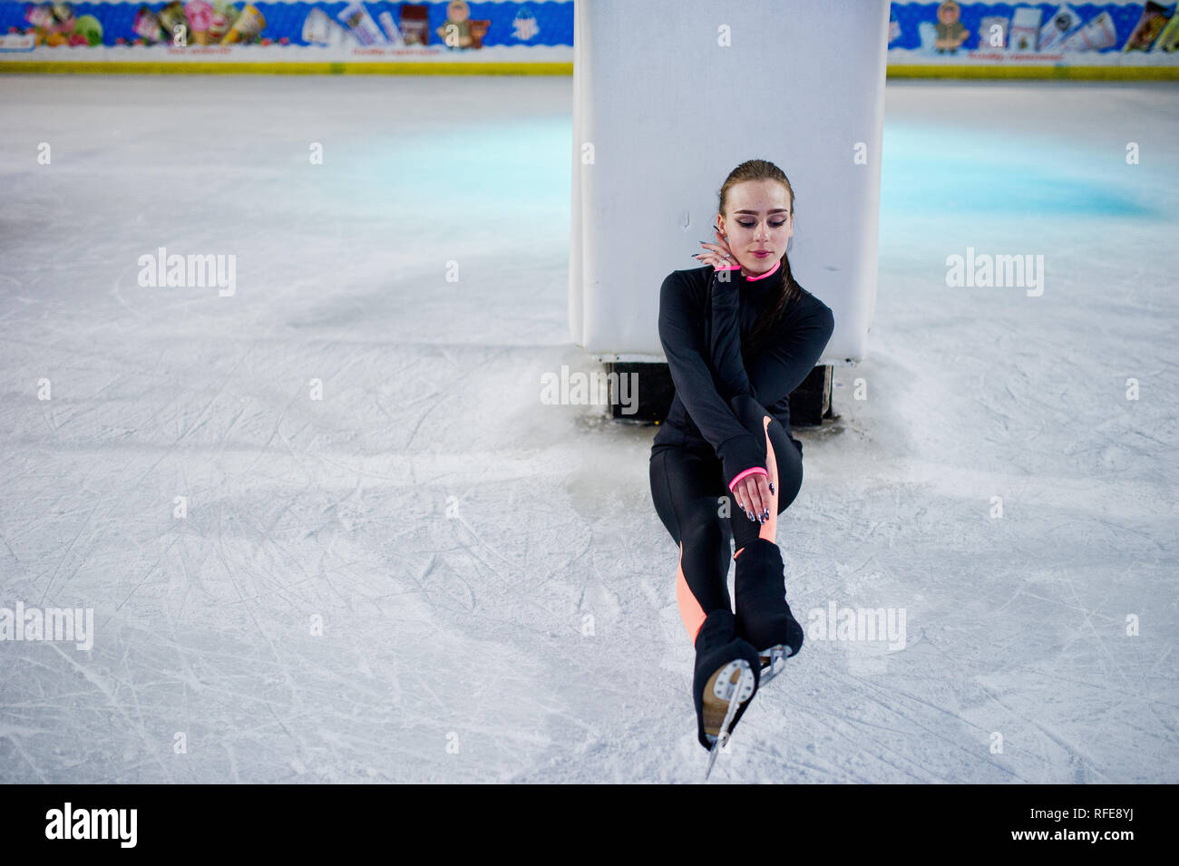 Figure skater woman at ice skating rink Stock Photo - Alamy